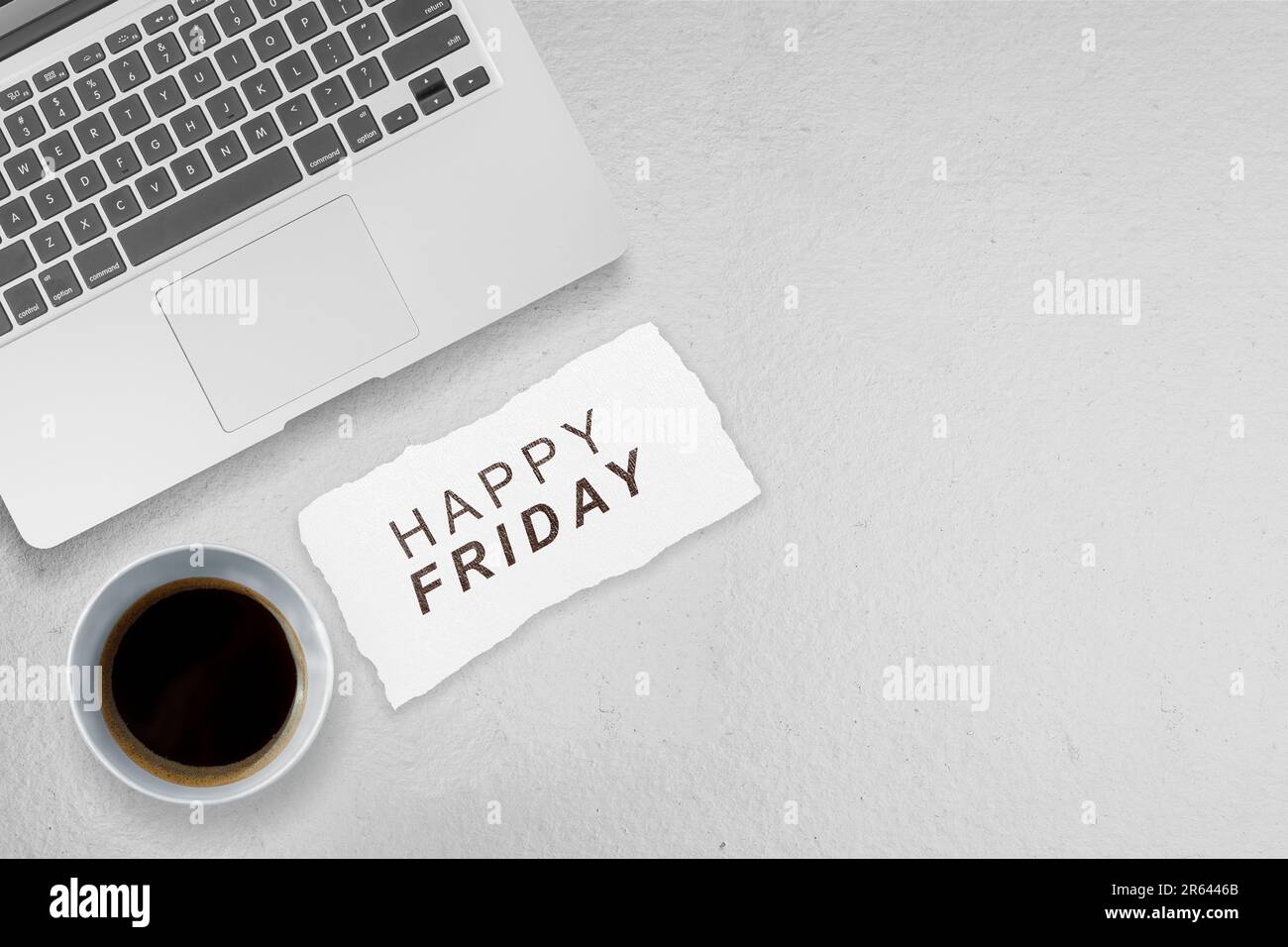 Laptop and coffee cup with a Happy Friday text. Happy Friday concept ...