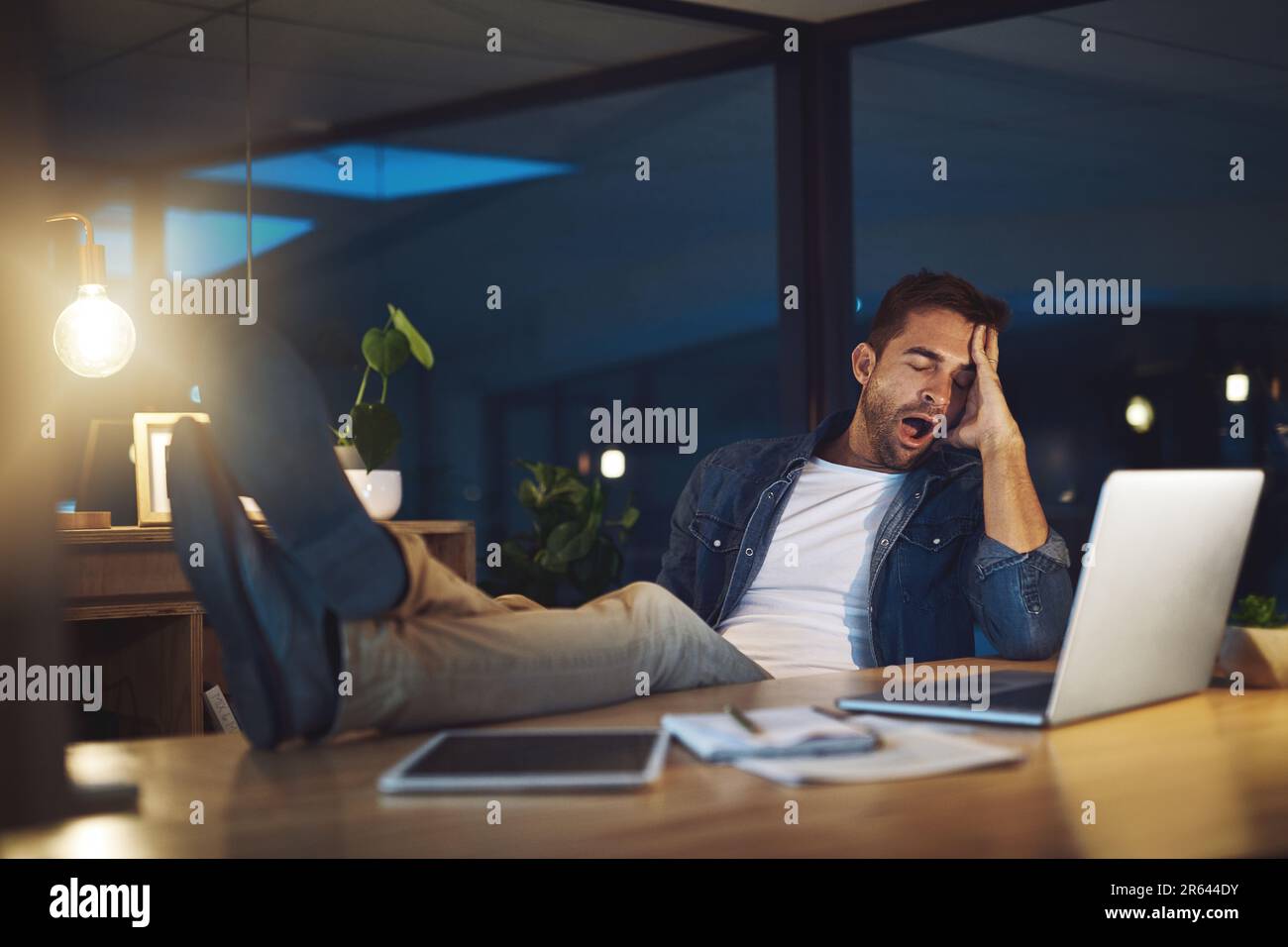 Sleep is definitely getting to me. a handsome young businessman falling ...