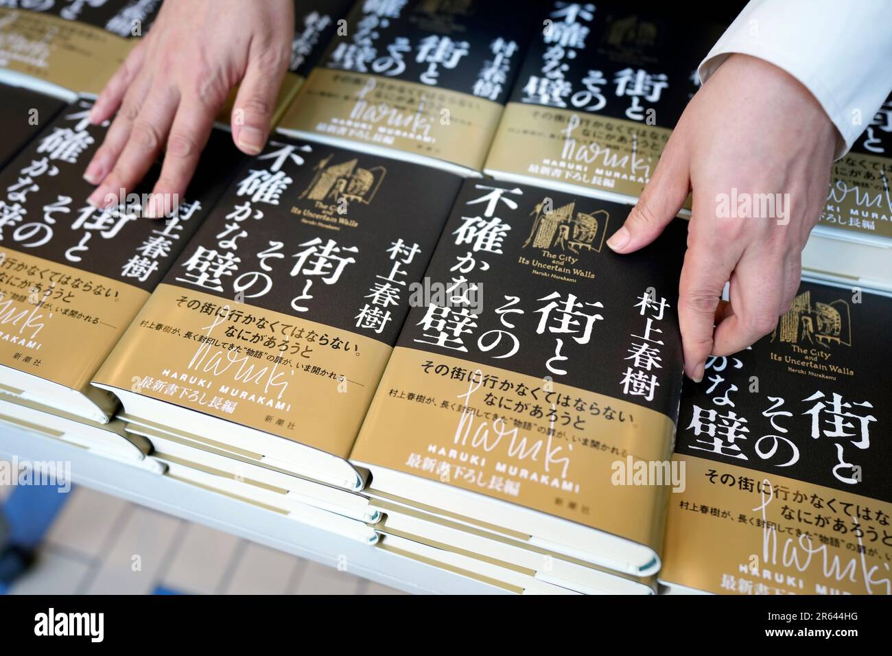 FILE - A shop clerk arranges a Japanese writer Haruki Murakami's new ...