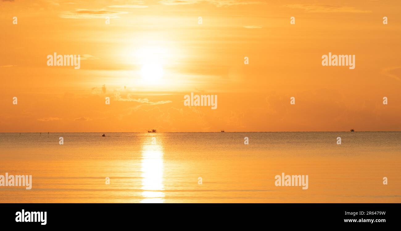 Golden dawn, sun rising up and reflection of first ray shining all over ...