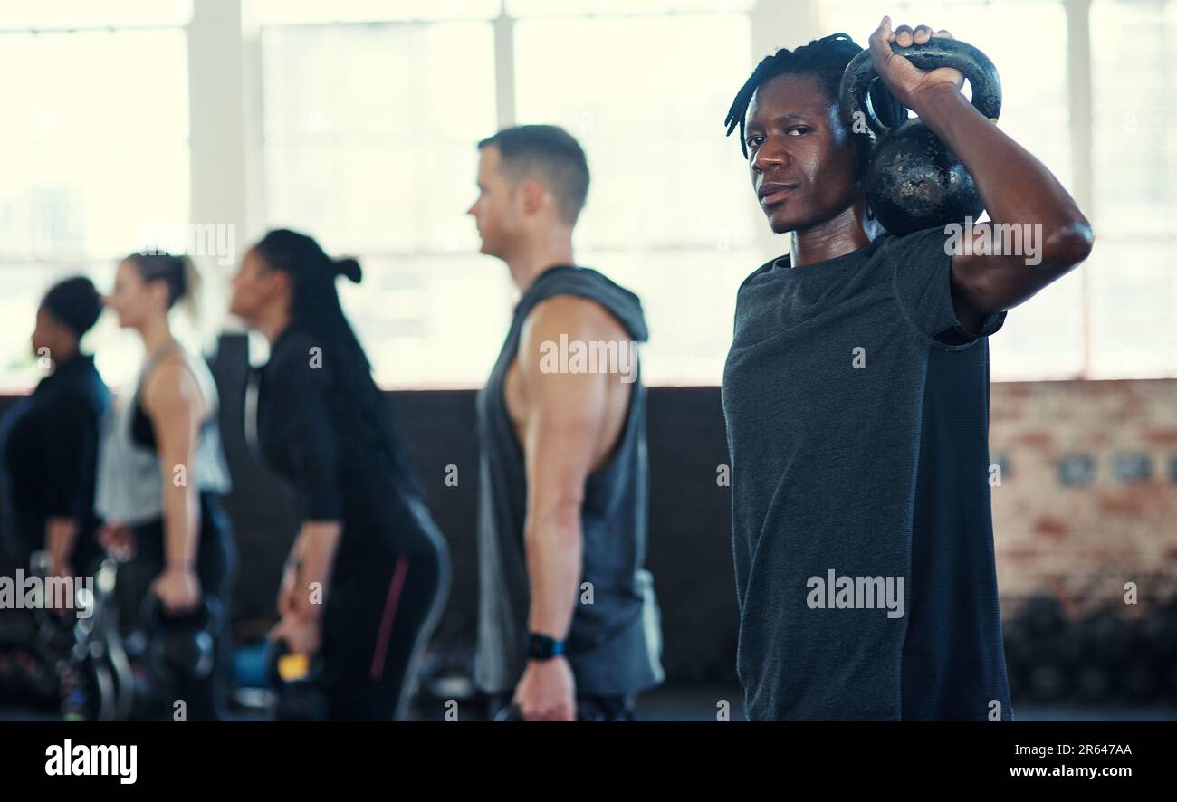 All about that fitness. a focused group of young people standing in a ...