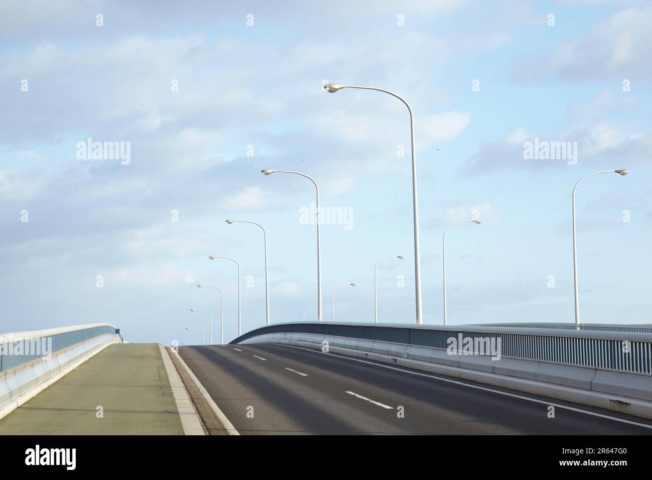 Bridge, blue sky and street lights Stock Photo - Alamy