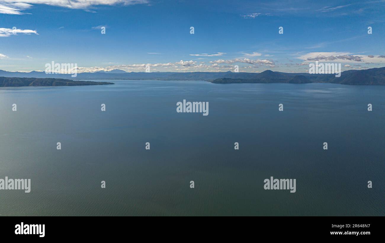 Lake Toba is located in the crater of a volcano and mountains. Sumatra ...