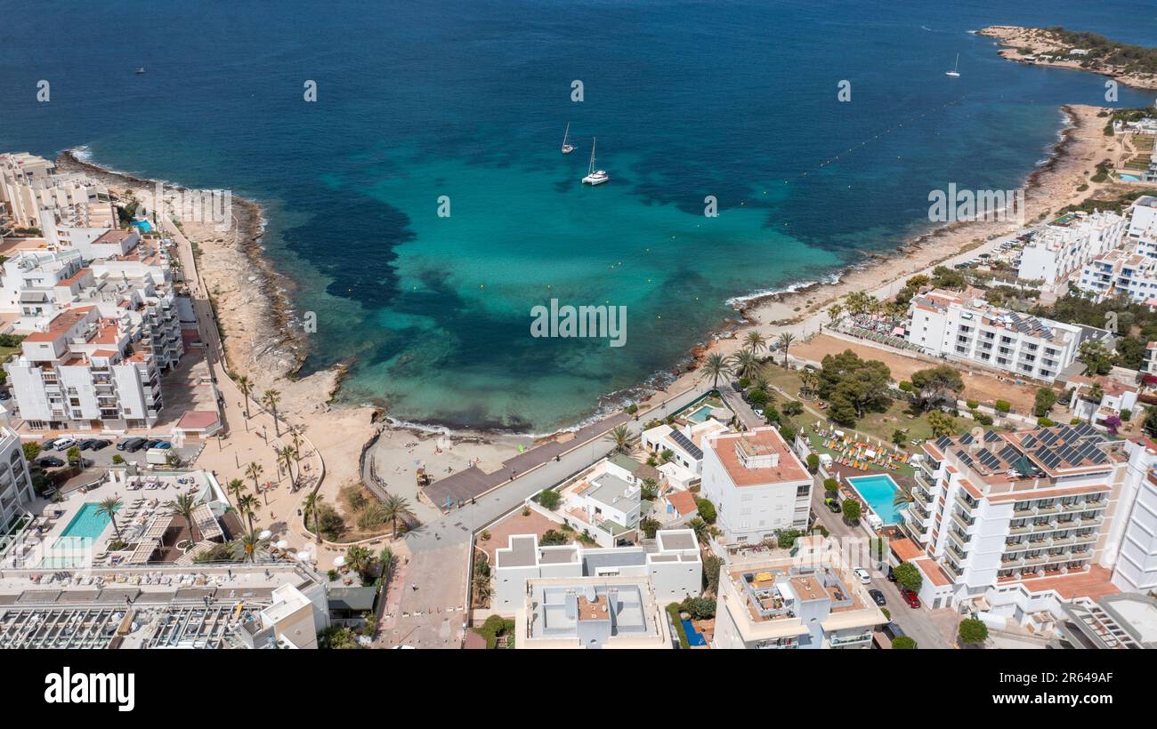 Aerial drone photo of a beach in the town of Sant Antoni de Portmany on ...