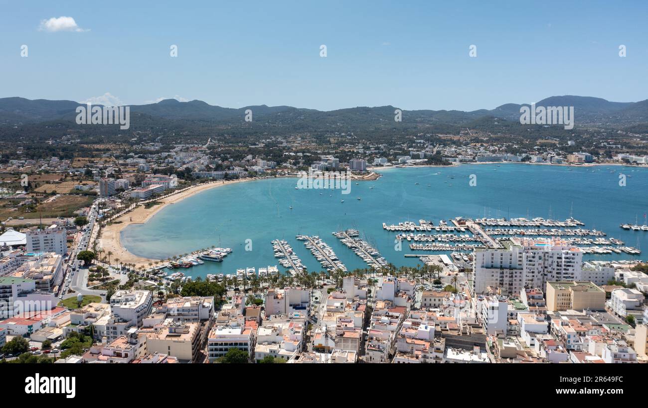 Aerial drone photo of a beach in the town of Sant Antoni de Portmany on ...