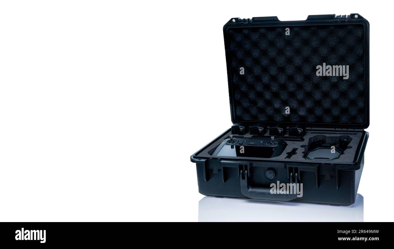 Drone and accessories in plastic case isolated on white background. UAV ...