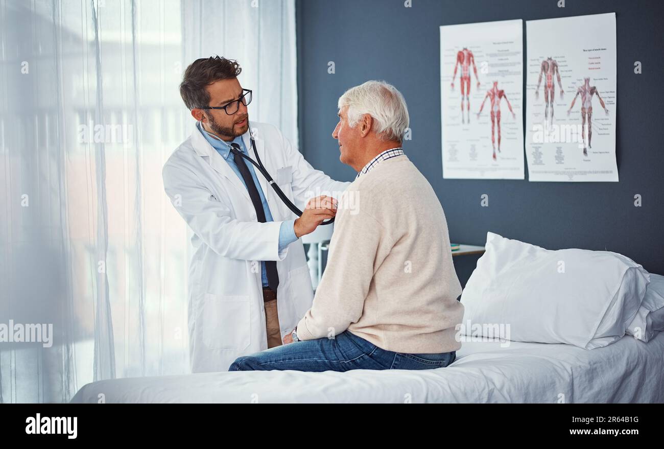 Regular checkups are vital for seniors. a doctor examining a senior ...