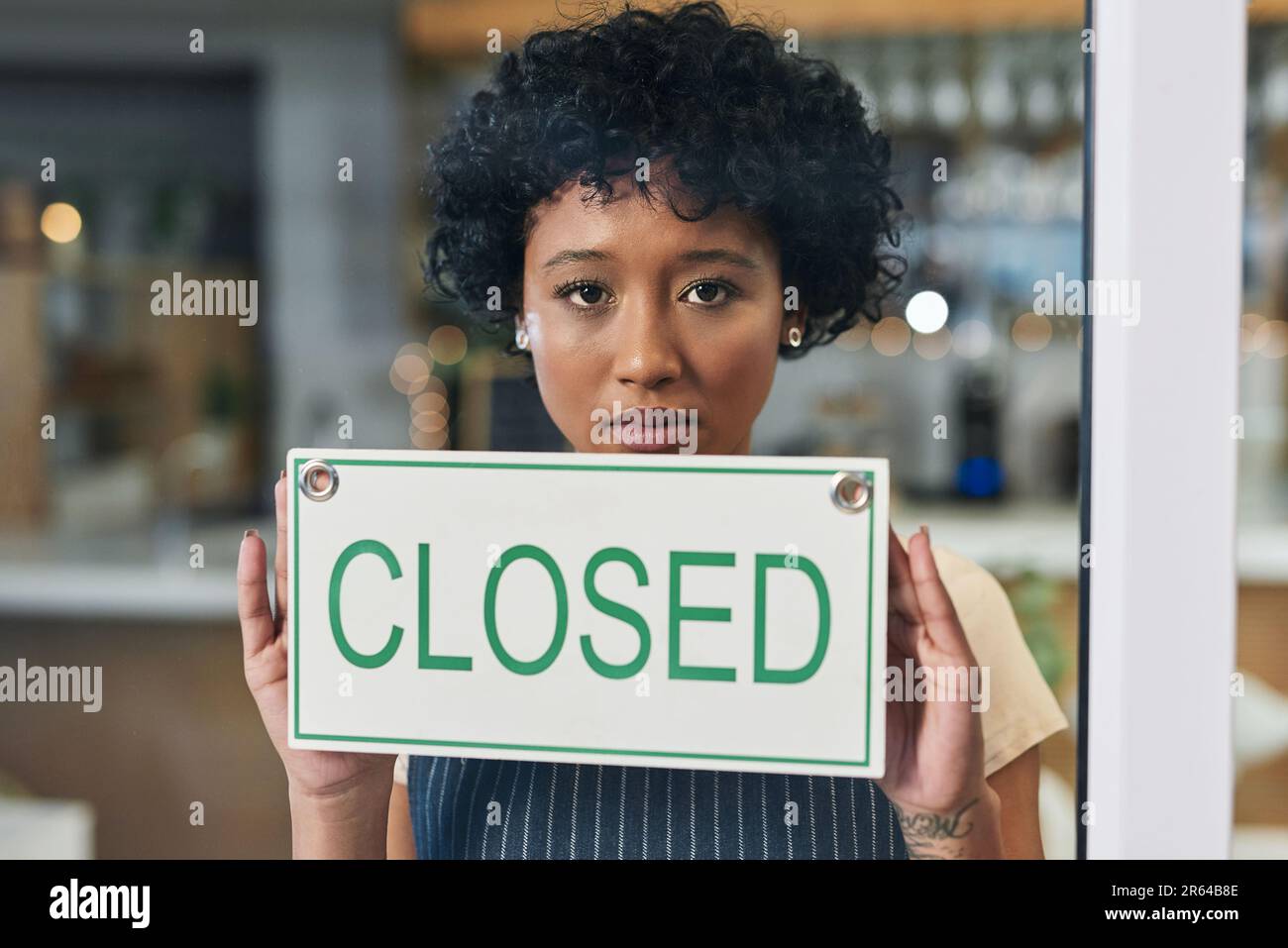Waitress holding sign close hi-res stock photography and images - Alamy