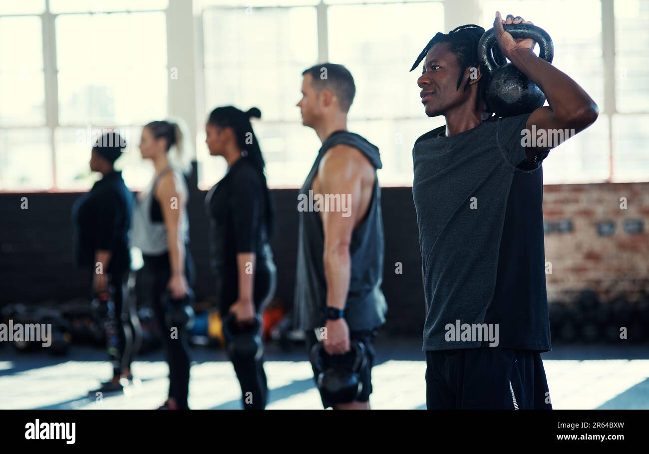 All together at the same time. a focused group of young people standing ...