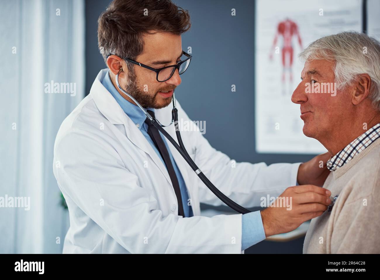 Its just a routine examination. a doctor examining a senior patient ...