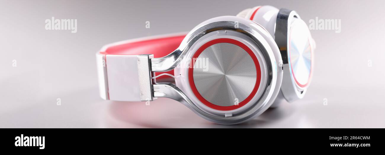 Modern red wireless headphones with white ear pads Stock Photo - Alamy