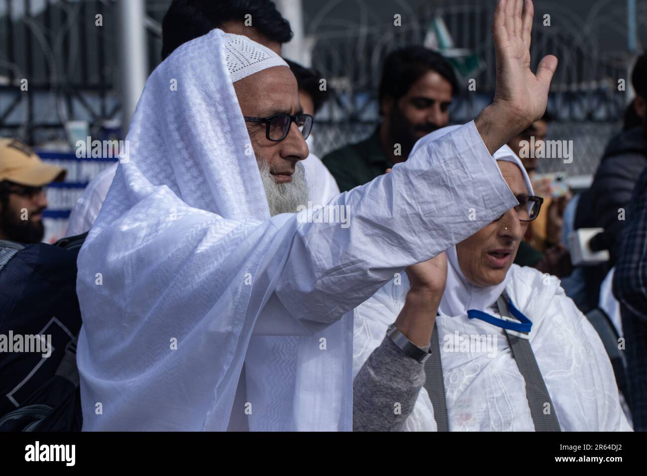 June 7, 2023, Srinagar, Jammu and Kashmir, India: A Kashmiri Muslim pilgrim waves his hand to ...