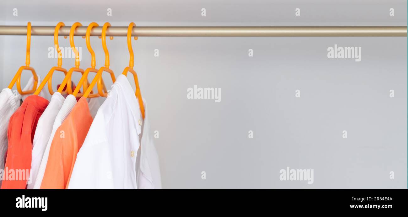 Different clothes on the rank in store. Concept for choice of fashion ...