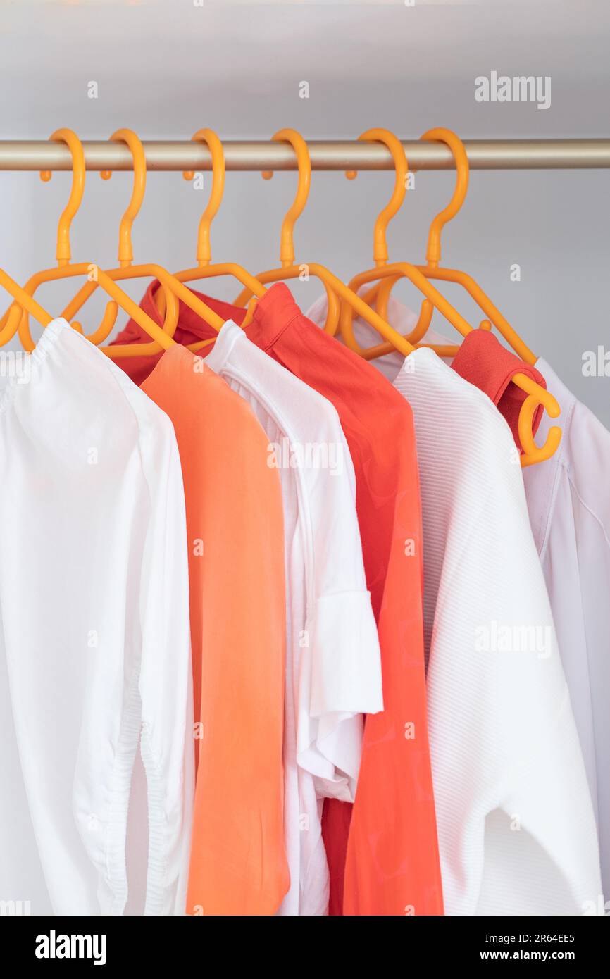 Different clothes on the rank in fashion store. Concept for choice of ...