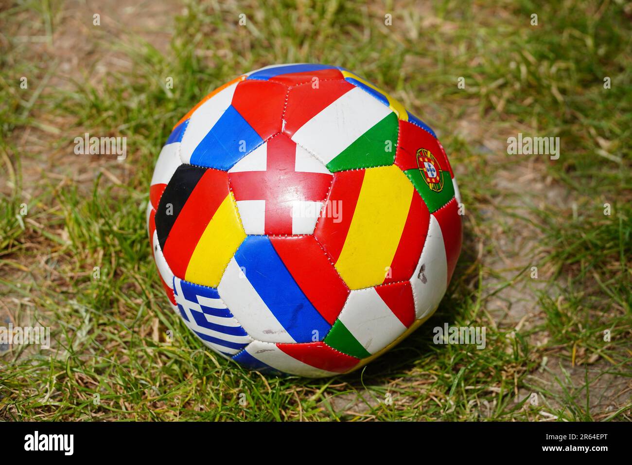A soccer ball adorned with the flags of many nations Stock Photo - Alamy