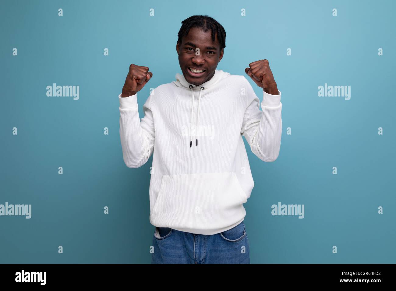 joyful winner black american young brunette man Stock Photo - Alamy