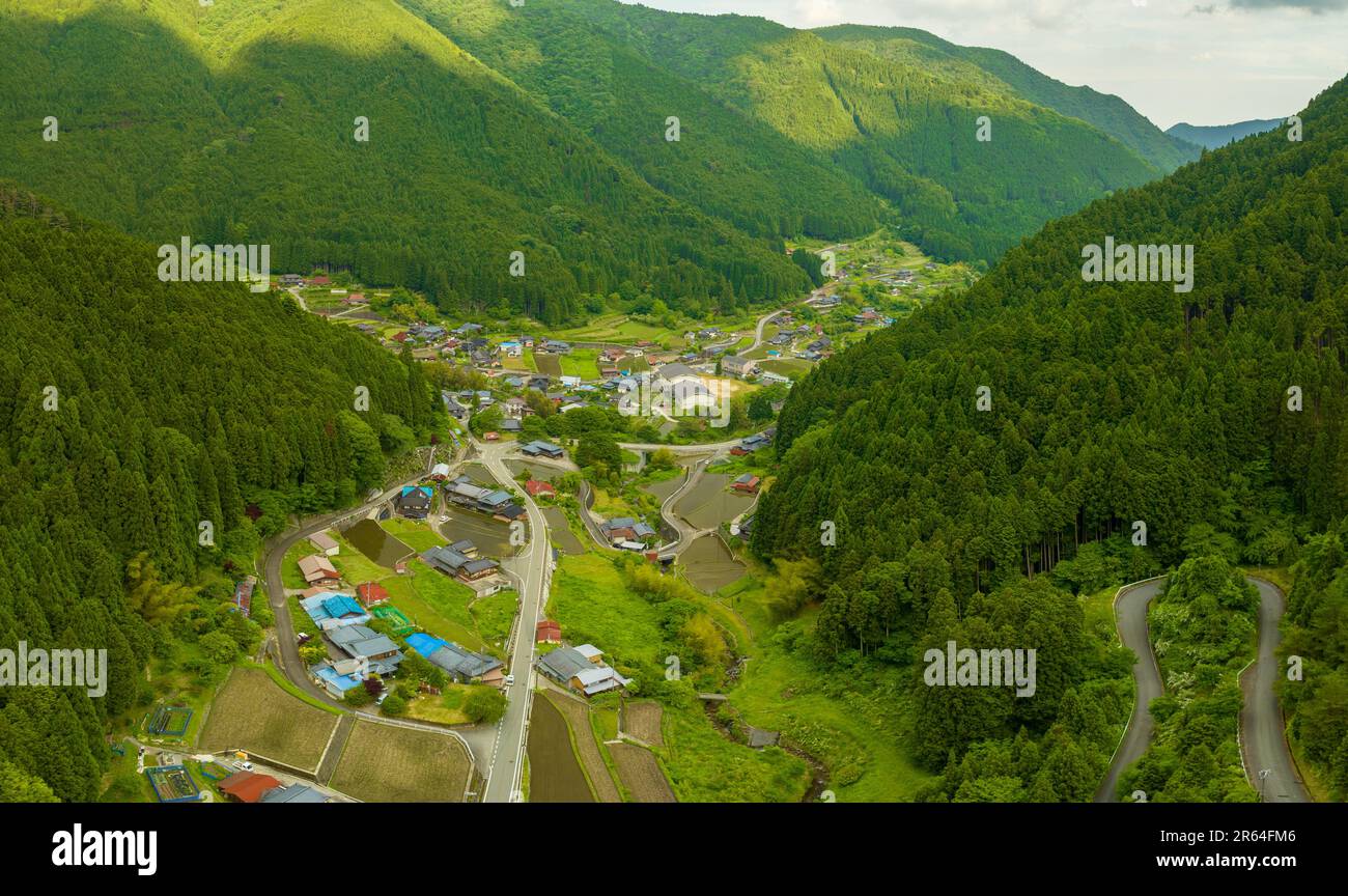 Small village and traditional Japanese houses in forested mountains ...