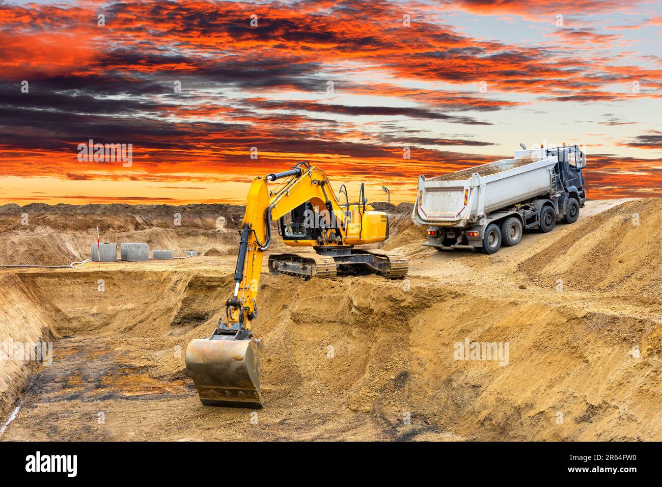 excavator is working and digging at construction site Stock Photo - Alamy