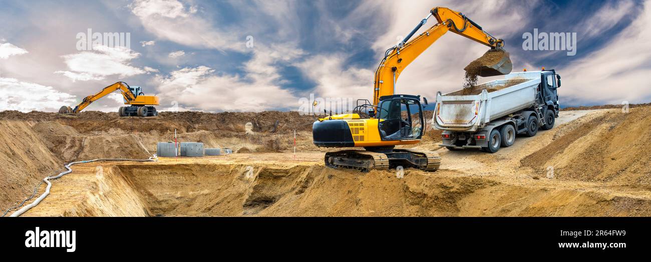 excavator is working and digging at construction site Stock Photo - Alamy