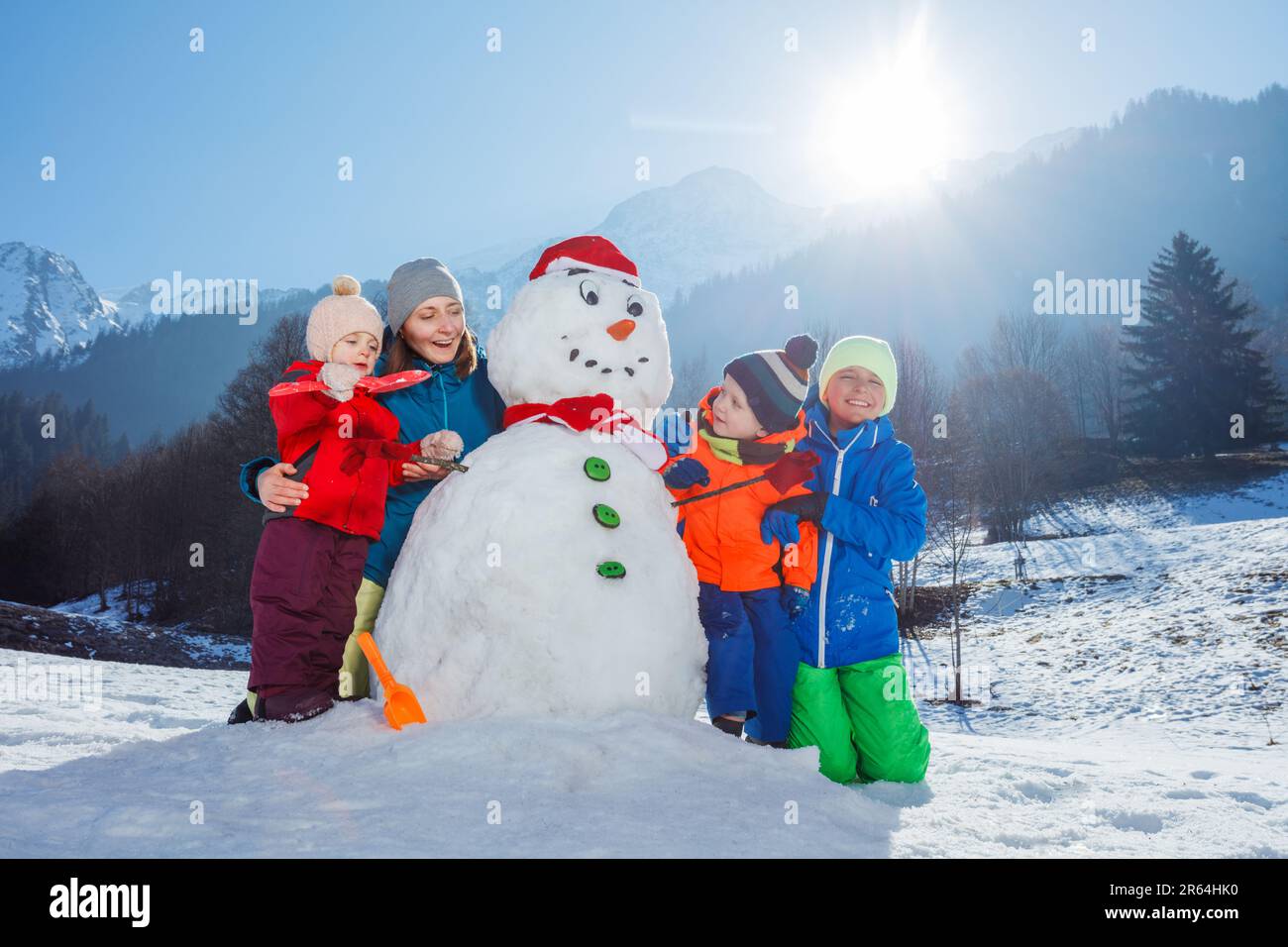 Children building snowman boy hi-res stock photography and images - Alamy
