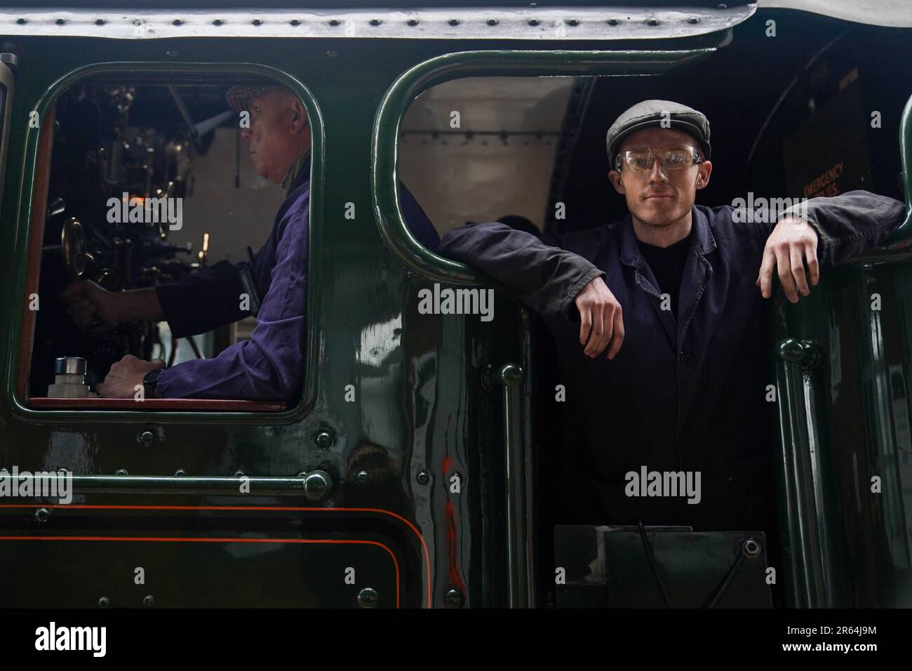 Drivers and engineers aboard The Flying Scotsman as she passes through ...