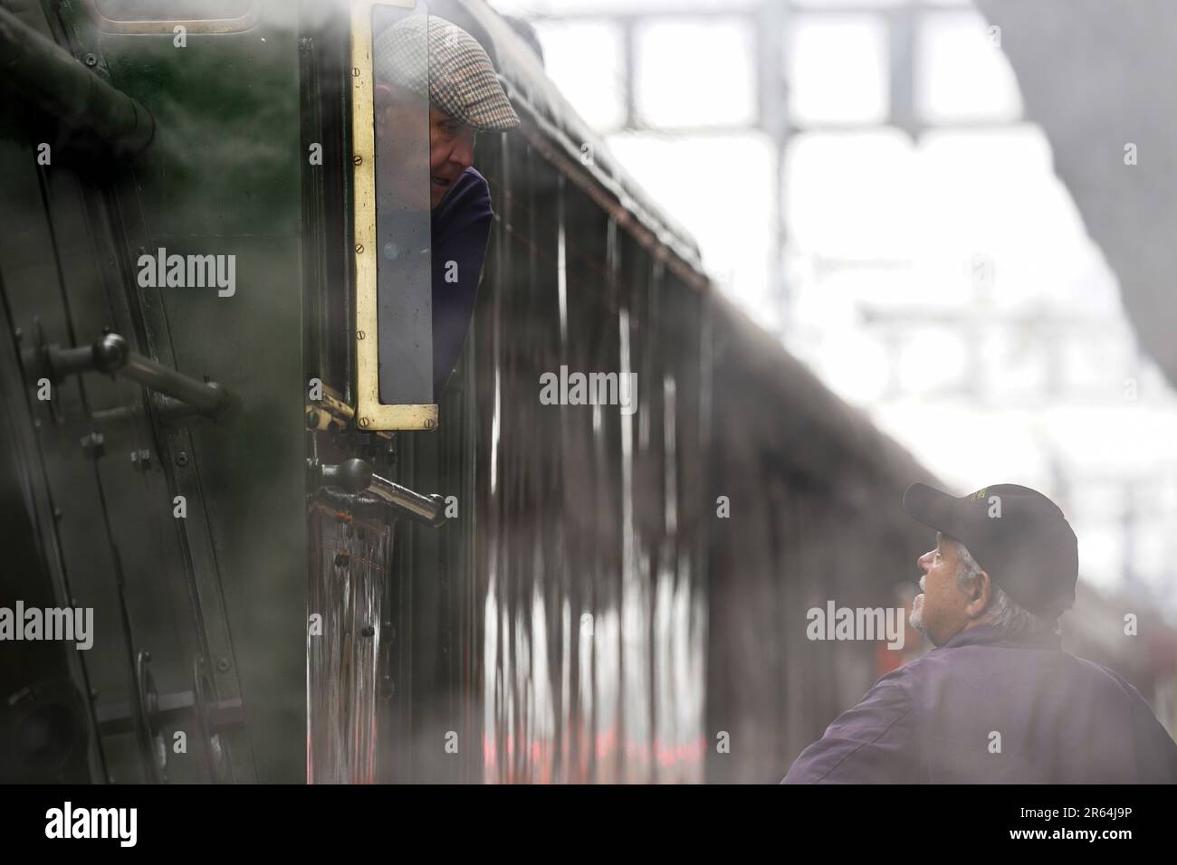 Drivers and engineers aboard The Flying Scotsman as she passes through ...