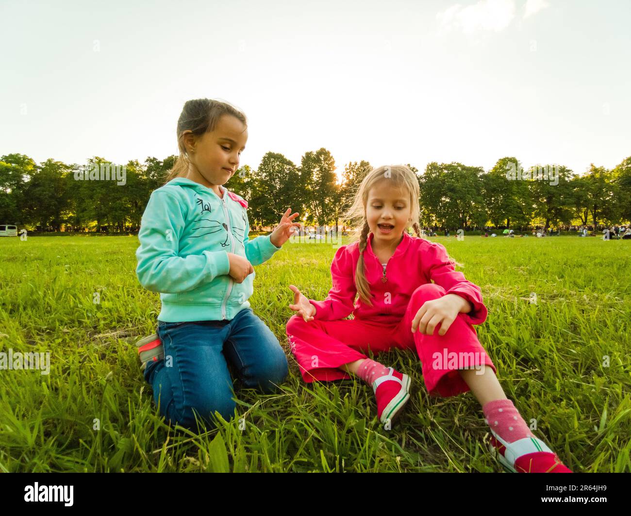 two little friends girls in the field Stock Photo - Alamy