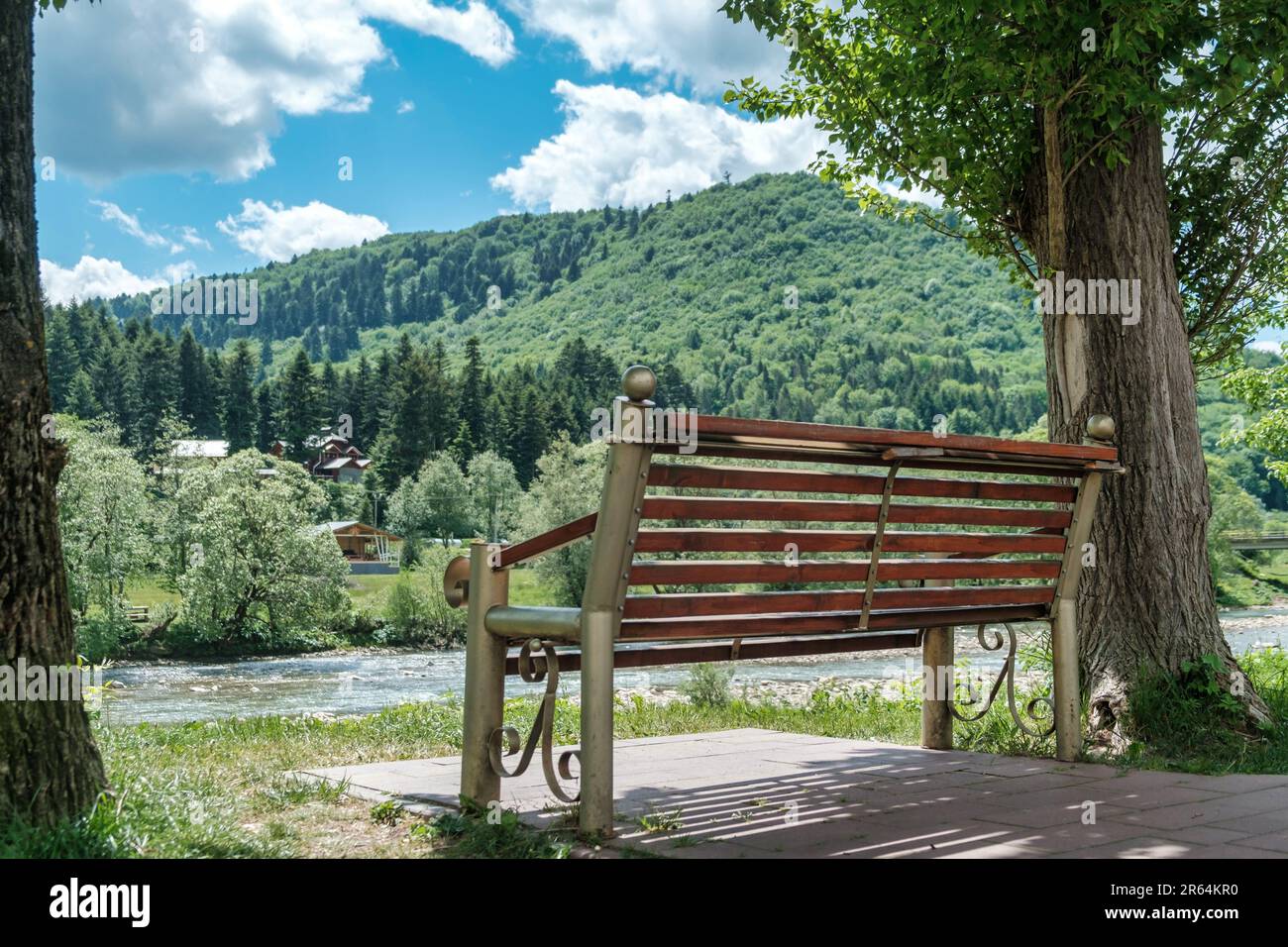 Bench in the mountains. Wooden bench in the mountain valley at the ...