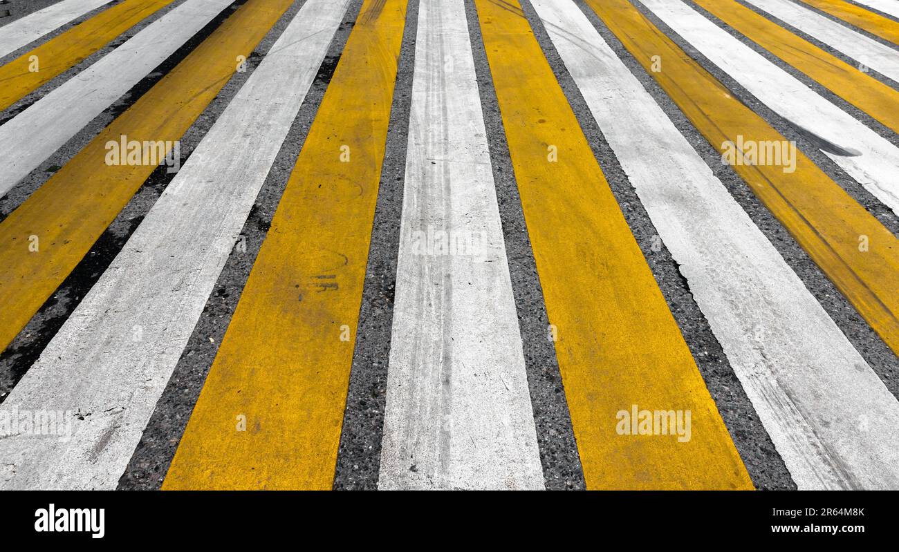Yellow white stripes over asphalt street pavement, perspective view ...
