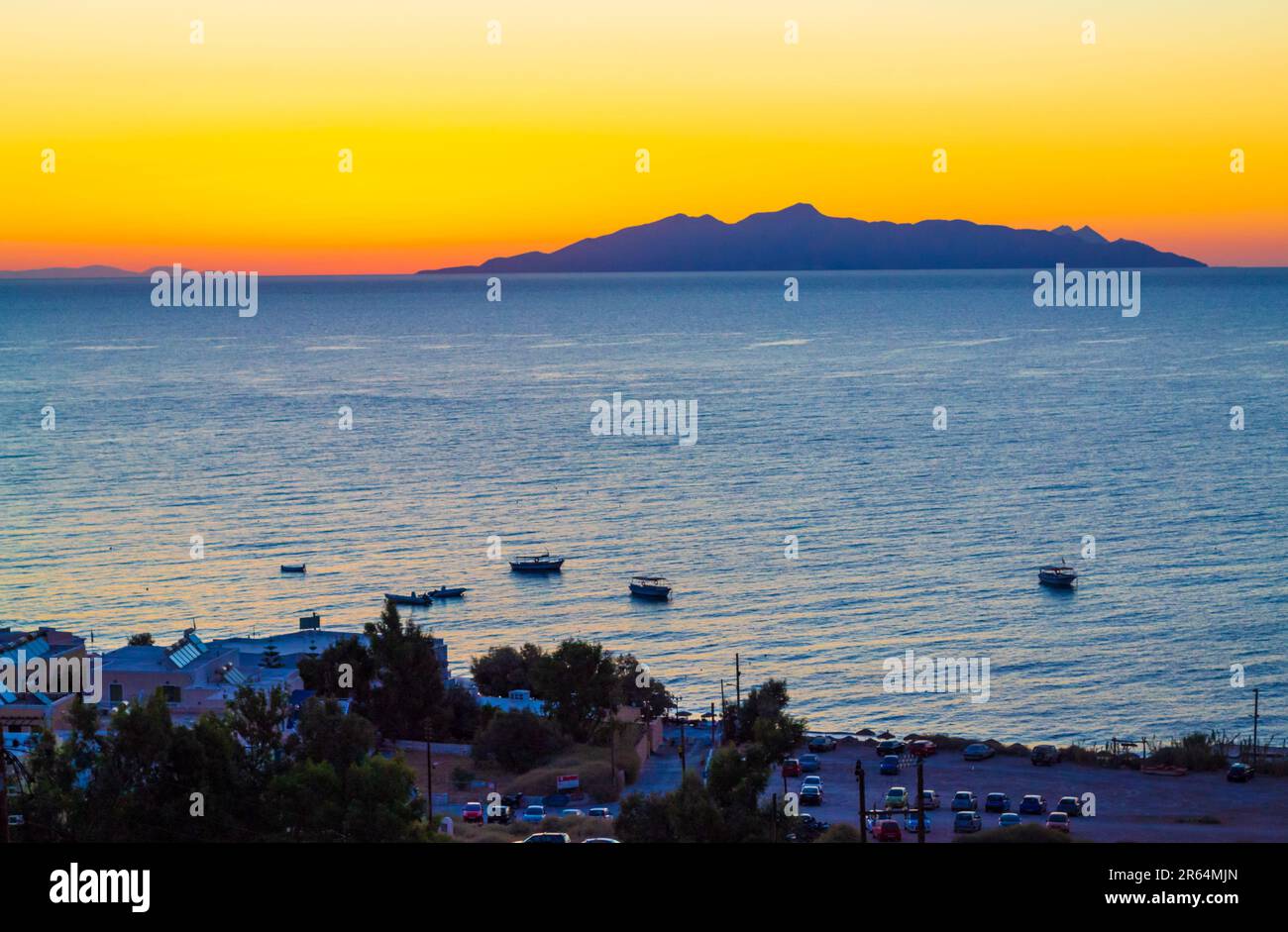 Sunrise over Aegean Sea,Anafi island in the distance and colorful dawn ...