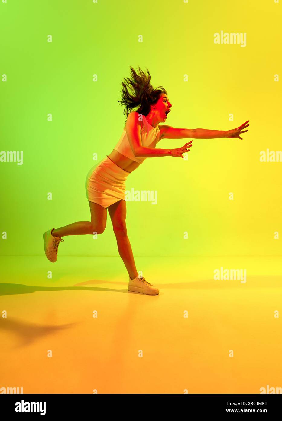 Portrait of emotive beautiful girl, business woman with flying hair ...