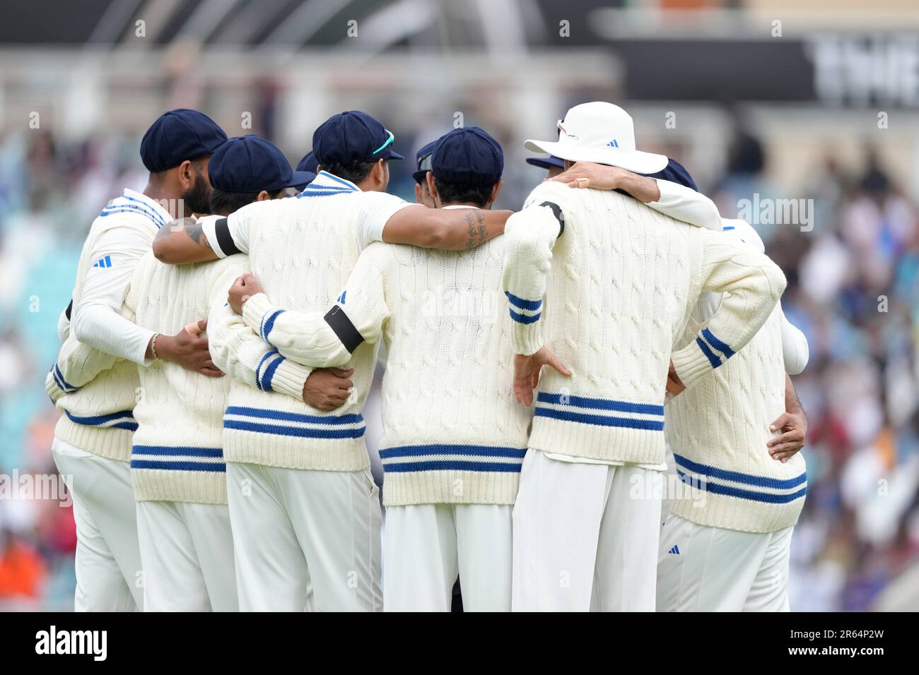 The Indian players huddle just before play starts on the first day of ...