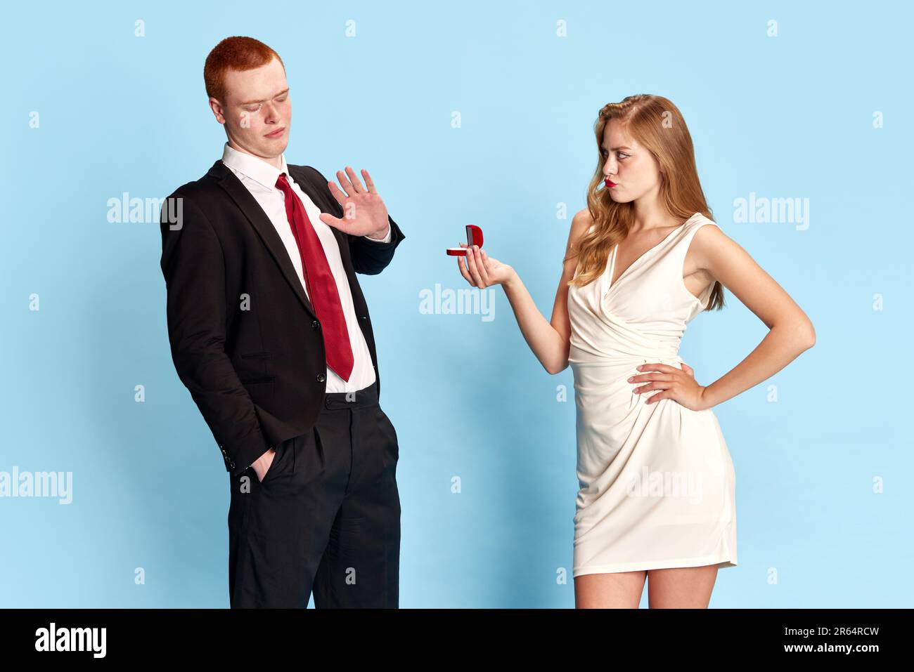 Beautiful young girl in white dress proposing to her boyfriend to get ...
