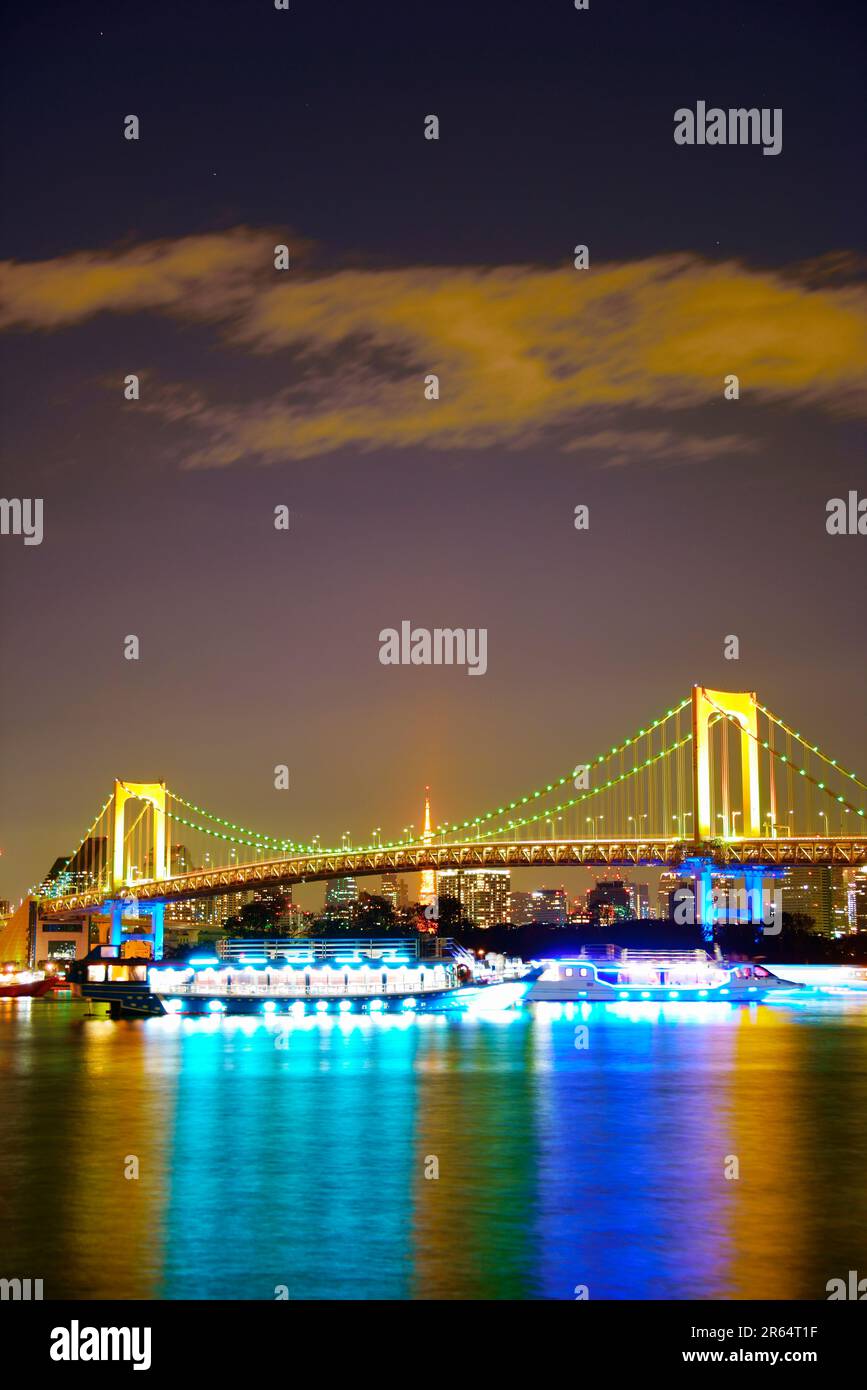 Rainbow-colored Rainbow Bridge, Tokyo Tower and houseboat Stock Photo ...