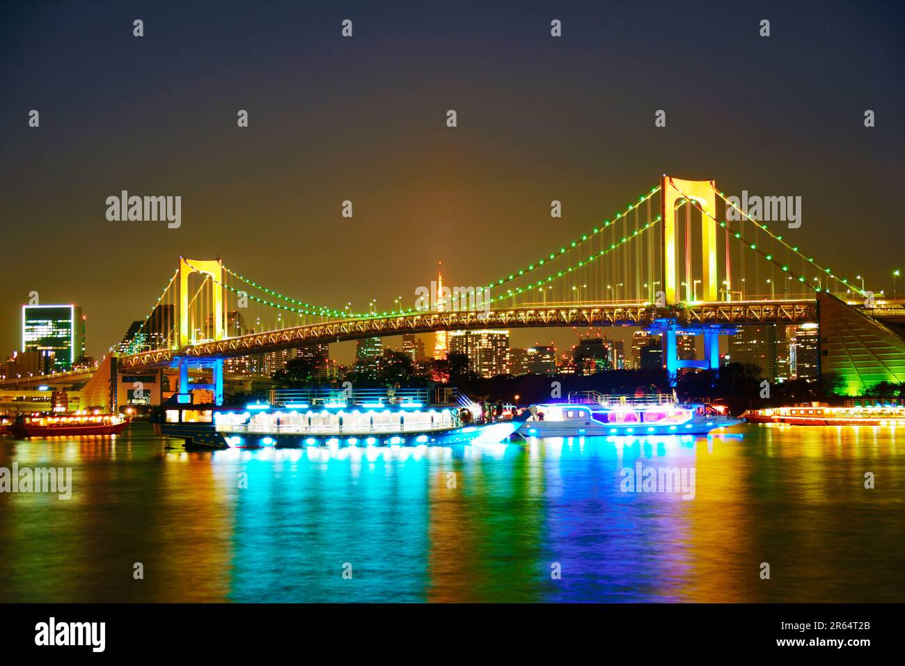Rainbow-colored Rainbow Bridge, Tokyo Tower and houseboat Stock Photo ...
