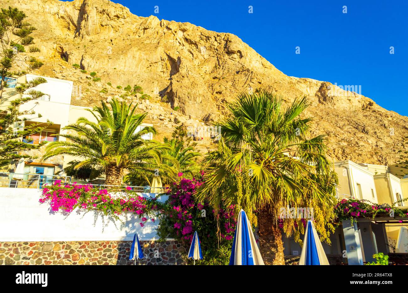 Picturesque architecture of Kamari village at sunrise at the foot of ...