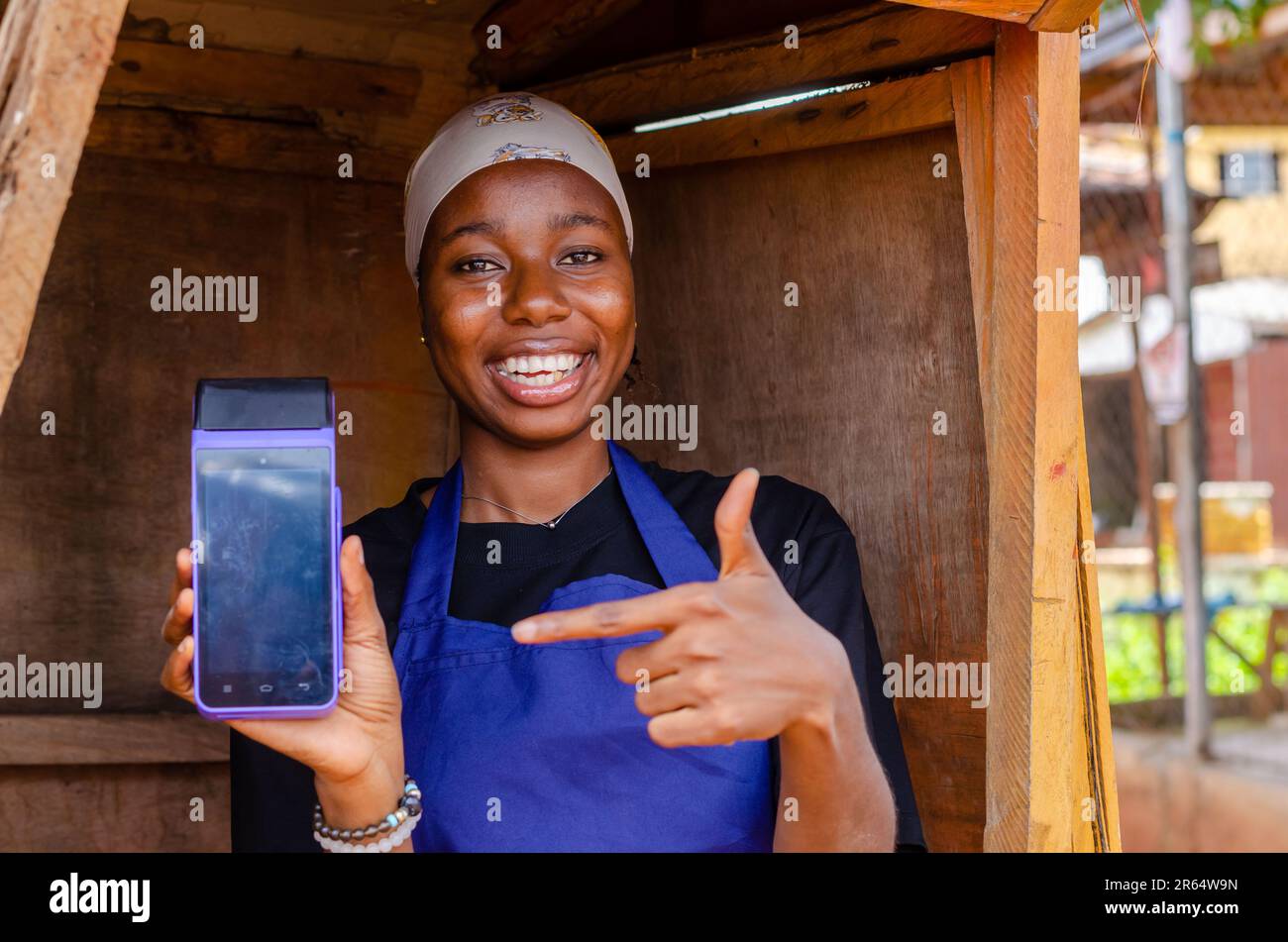 an african lady making use of her pos machine Stock Photo - Alamy