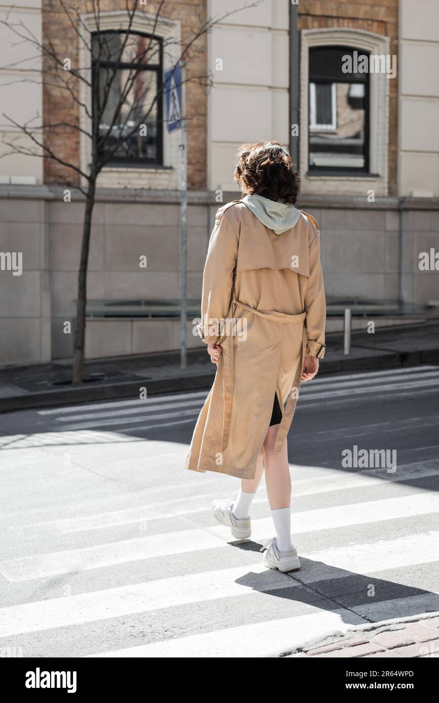 Woman in trench coat back view hi-res stock photography and images - Alamy