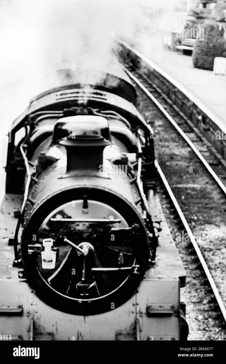 Vintage steam loccomotive in at a station platform on The Watercress ...