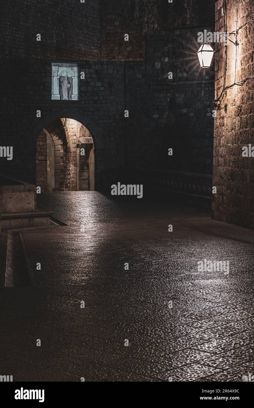 Illuminated passageways around the old town harbour gatehouse in ...