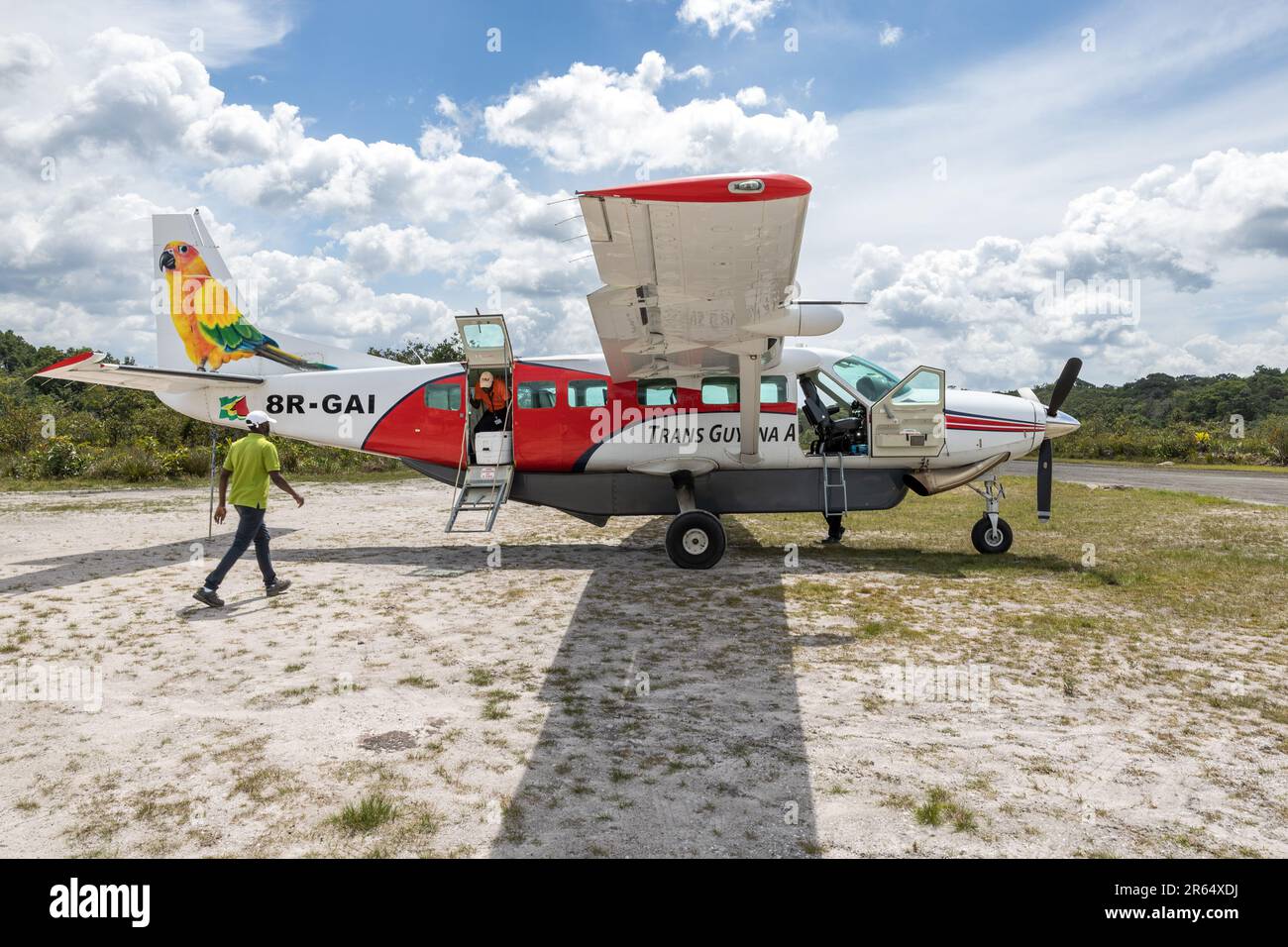 Unloading, 12-seater Trans Guyana Airways, Sun Parakeet emblem ...