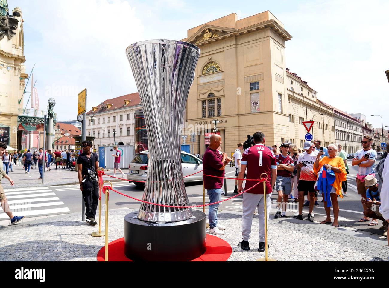 West Ham United fans pose for a photo in front of a large scale replica ...