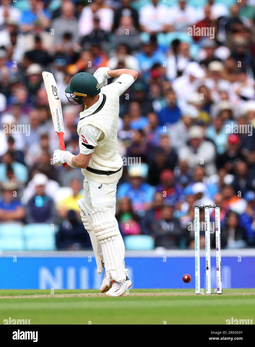 Australia's Marnus Labuschagne reacts after his hand is hit by the ball ...
