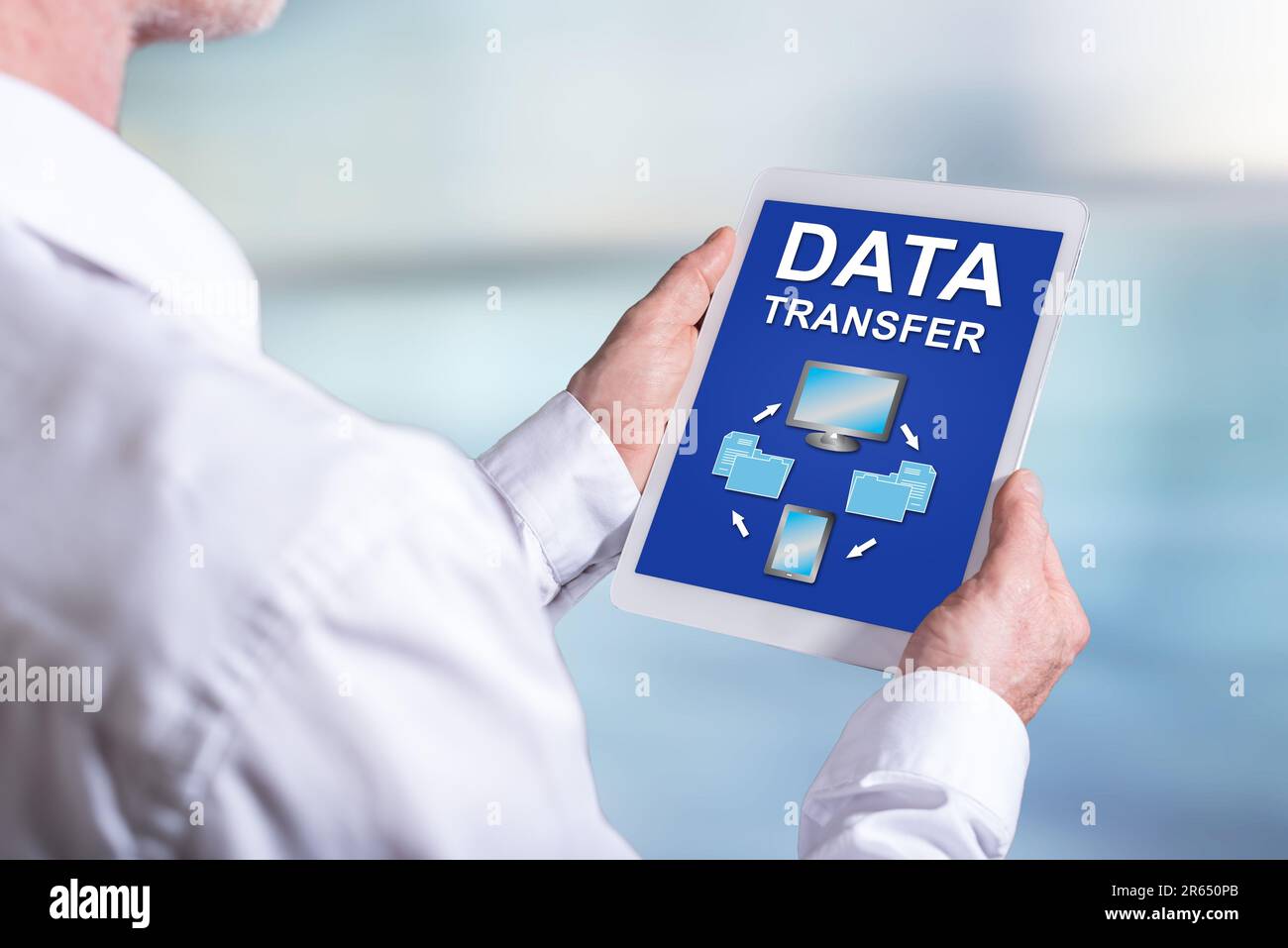 Tablet screen displaying a data transfer concept Stock Photo - Alamy