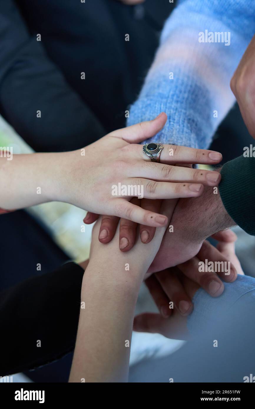A top view photo of group of businessmen holding hands together to ...