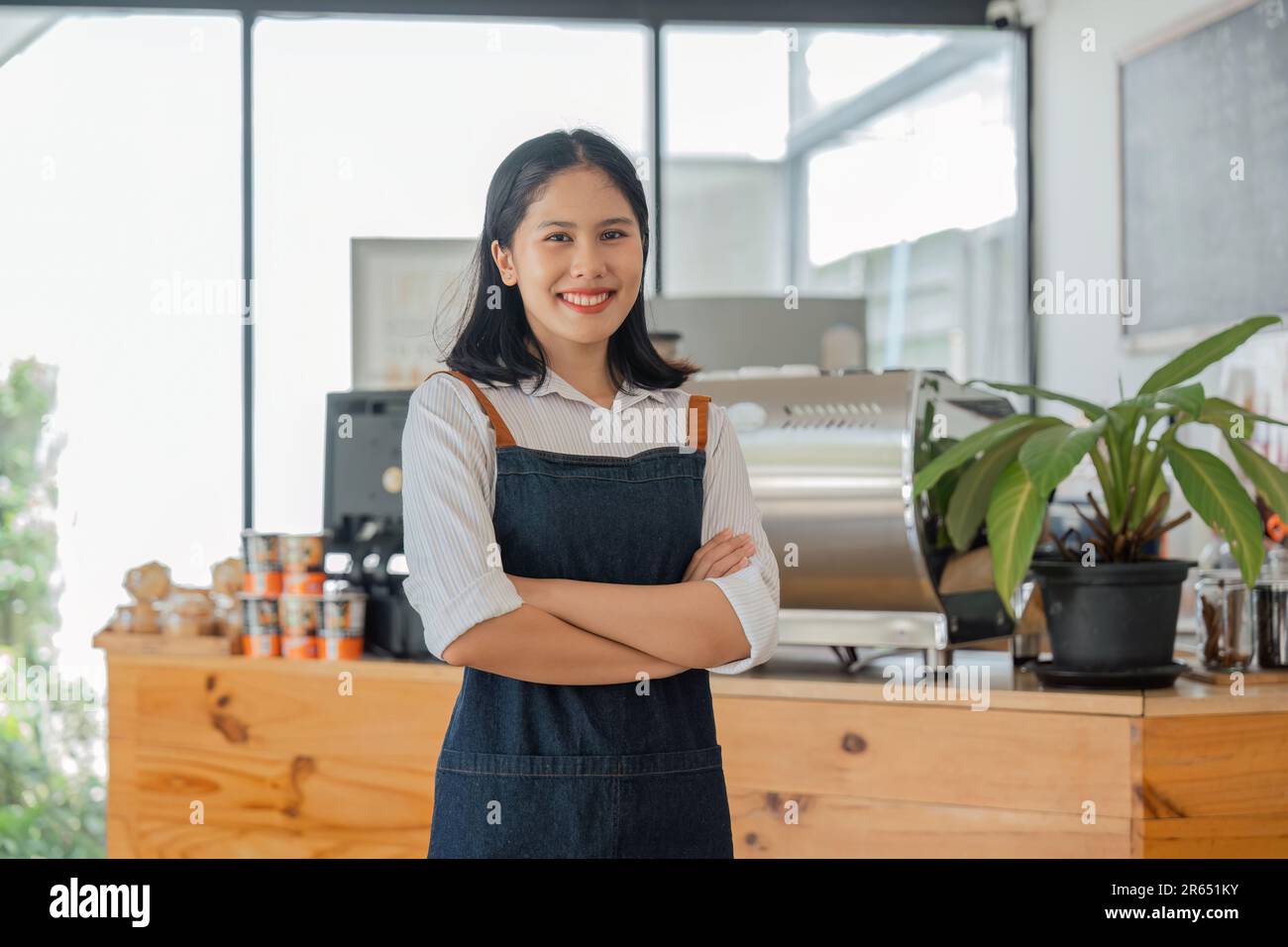 Asian woman coffee shop employee barista working at cafe. Smiling ...