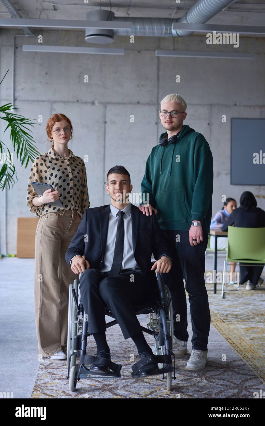 A businessman with disability in a wheelchair is surrounded by ...