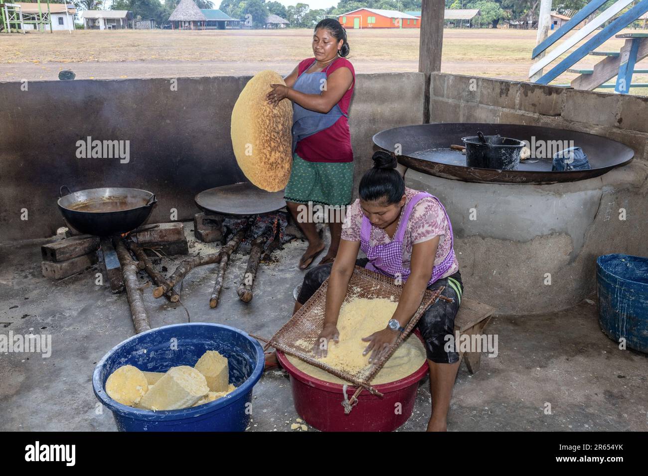 Preparing Casava, cooking into Farine, AmerIndian village (first nation ...