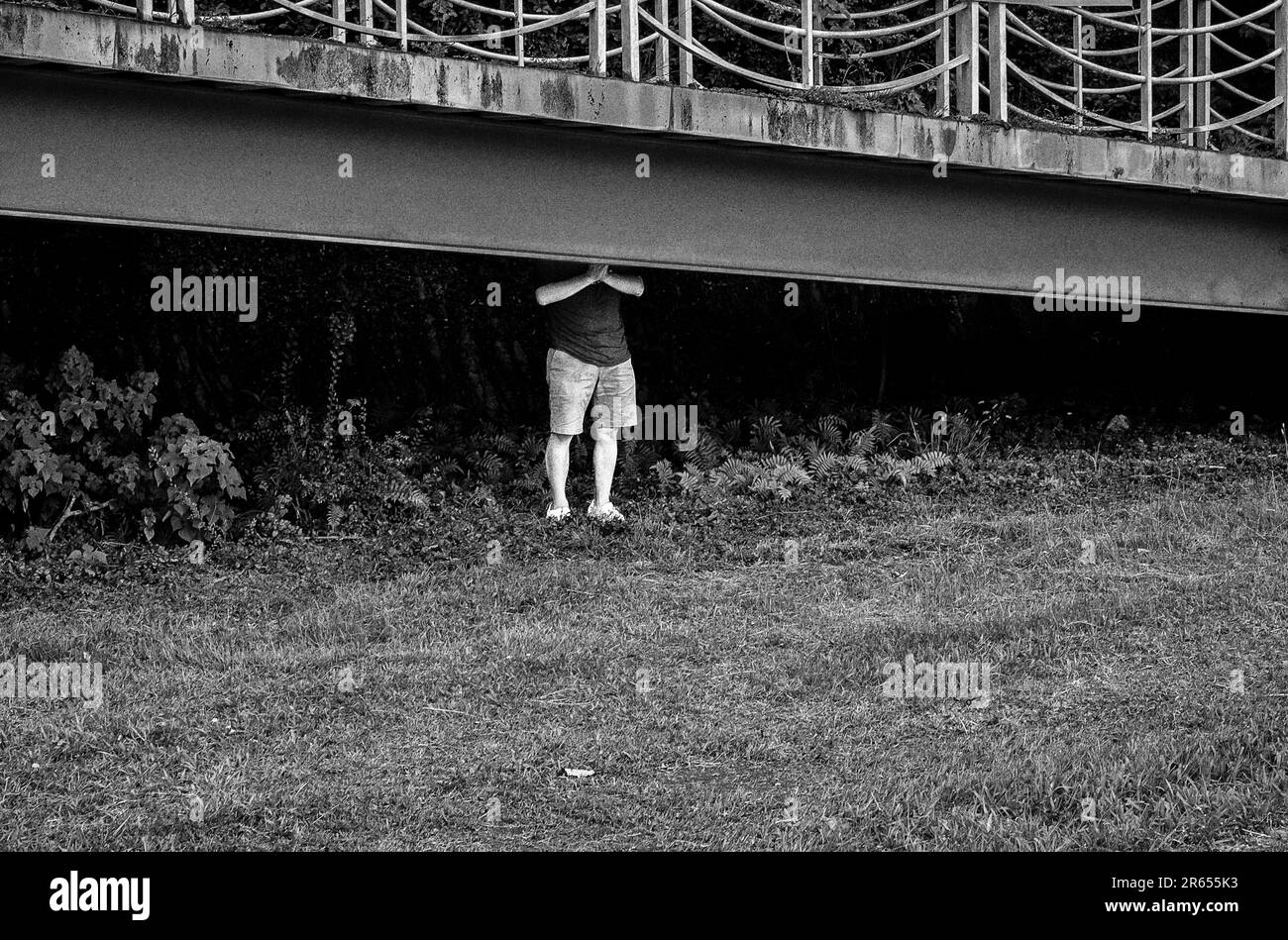 Taipei. 07th June, 2023. A man prays with folded hands under a bridge ...