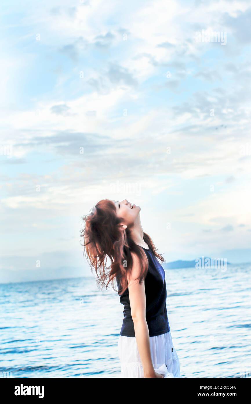 Woman Playing on Beach Stock Photo - Alamy